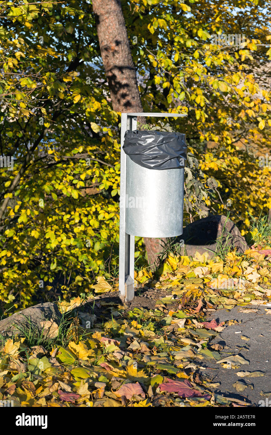 Outdoor Trash Can in Park at Autumn Stock Photo - Alamy