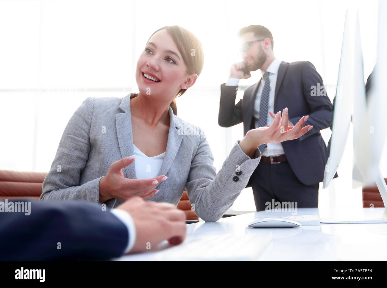 female consultant communicating with the client Stock Photo - Alamy