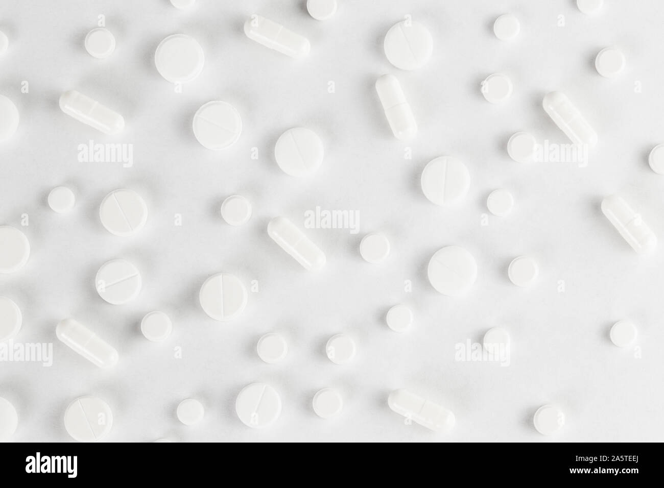 pills flat background, tablets spreaded on a white - top-down view ...