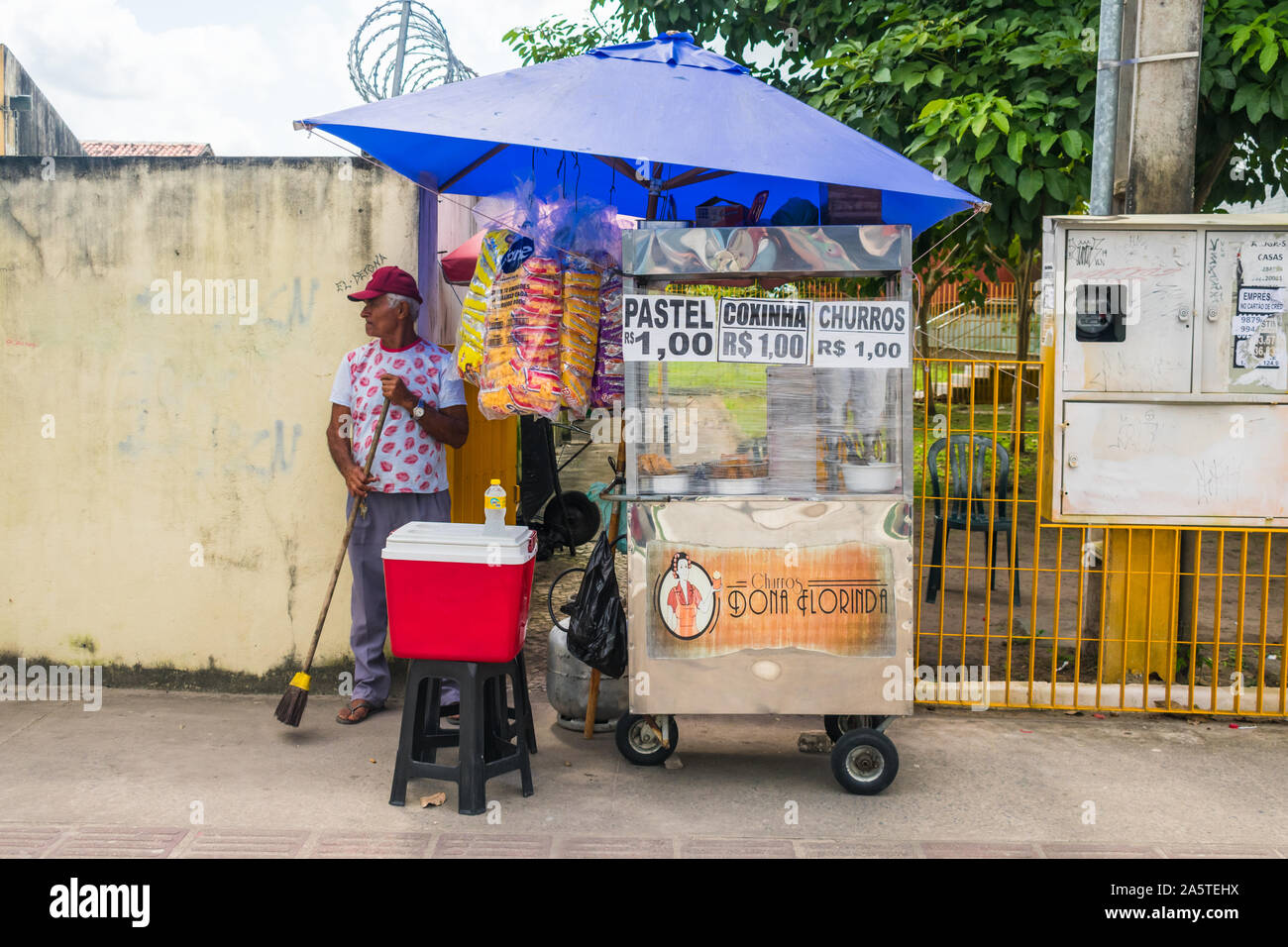 Street vendor selling typical Brazilian snacks like "Pastel" and ...