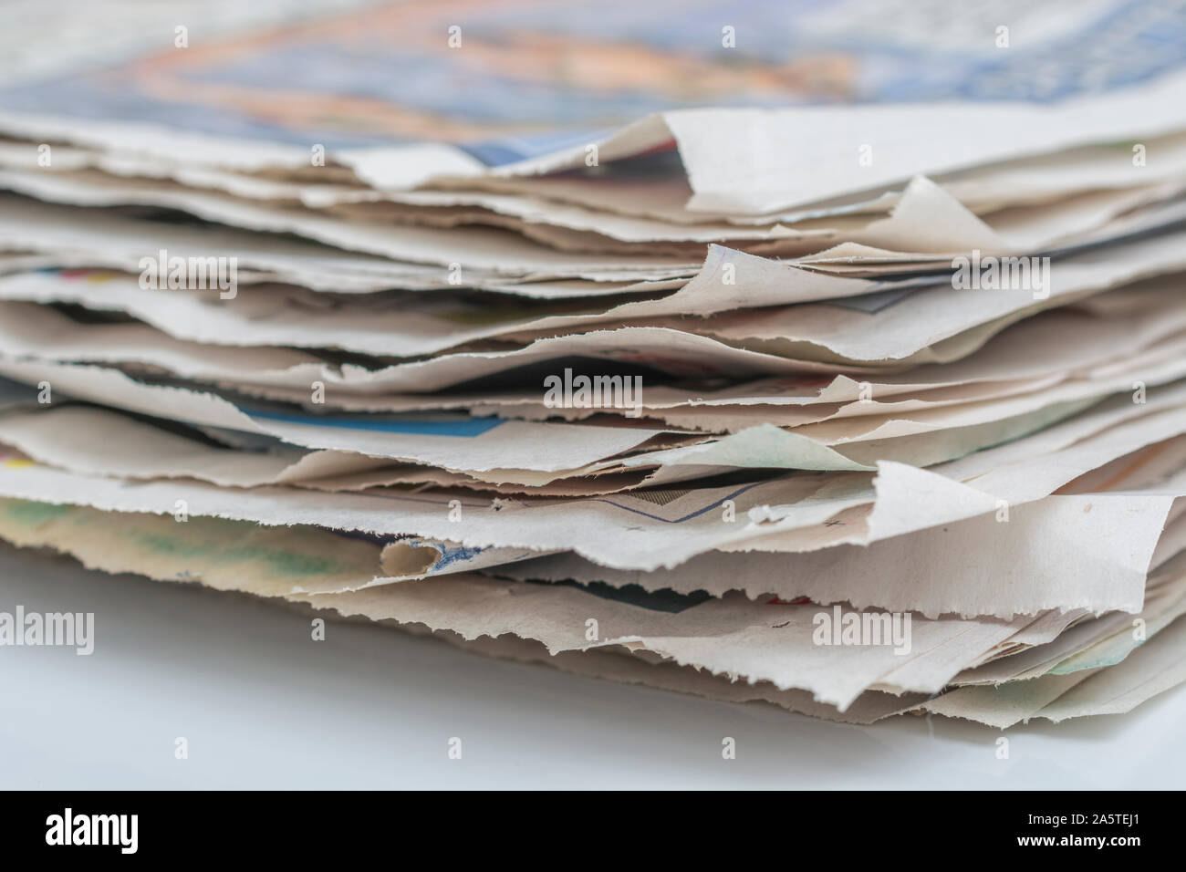 Old newspaper pages stacked. Traditional print media, front page news ...