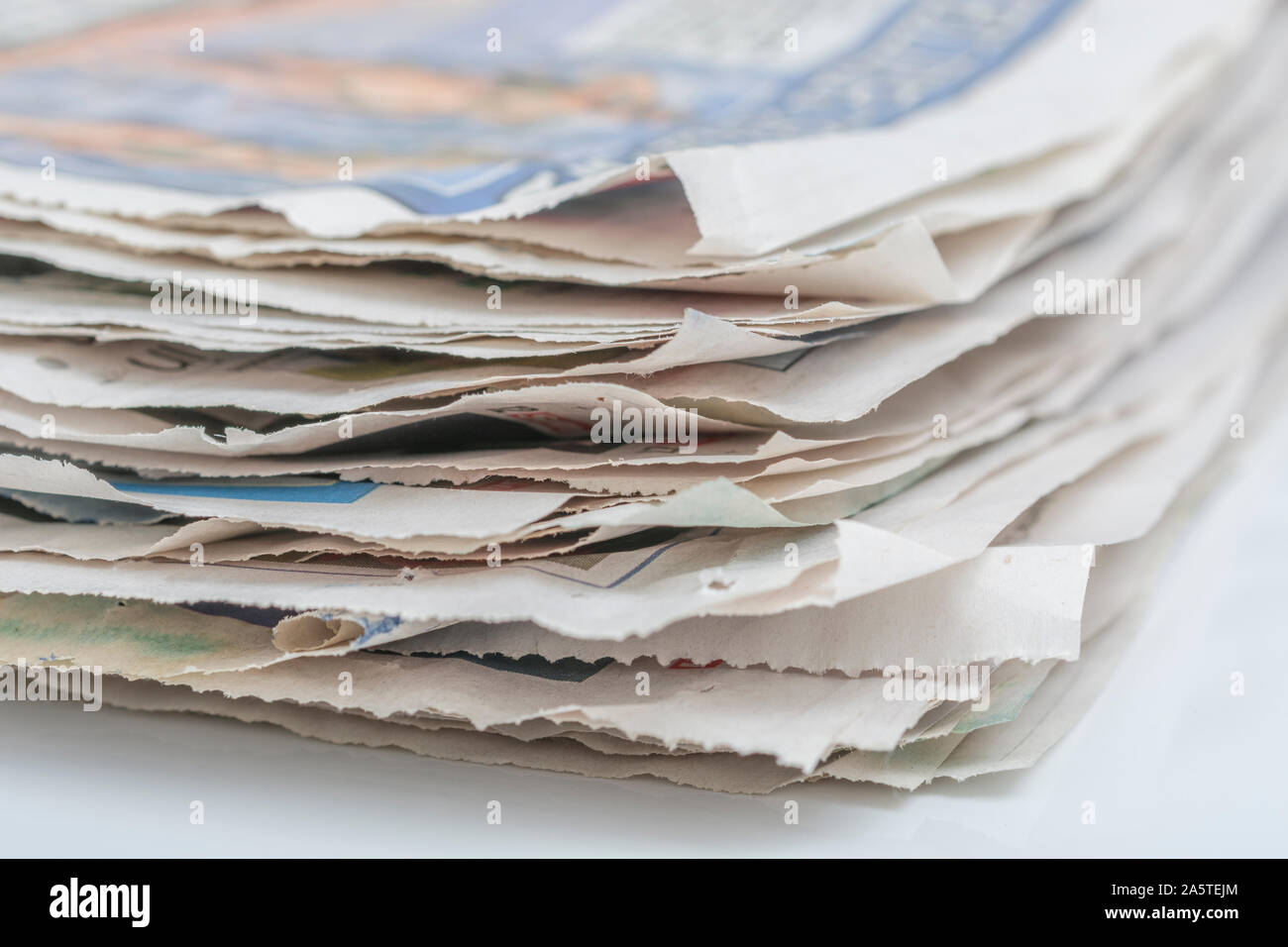 Old newspaper pages stacked. Traditional print media, front page news ...