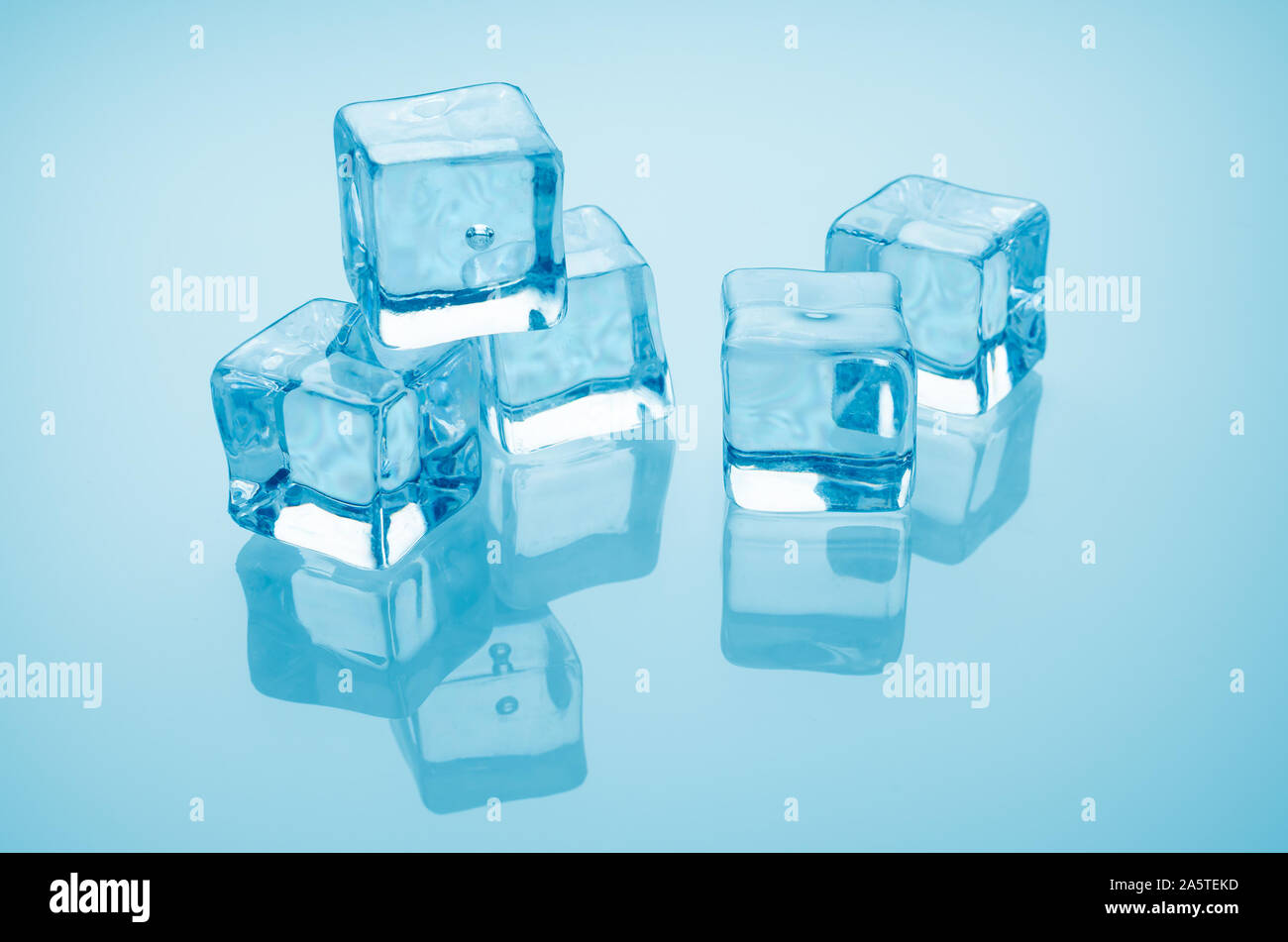 artificial ice cubes on blue background, closeup Stock Photo - Alamy