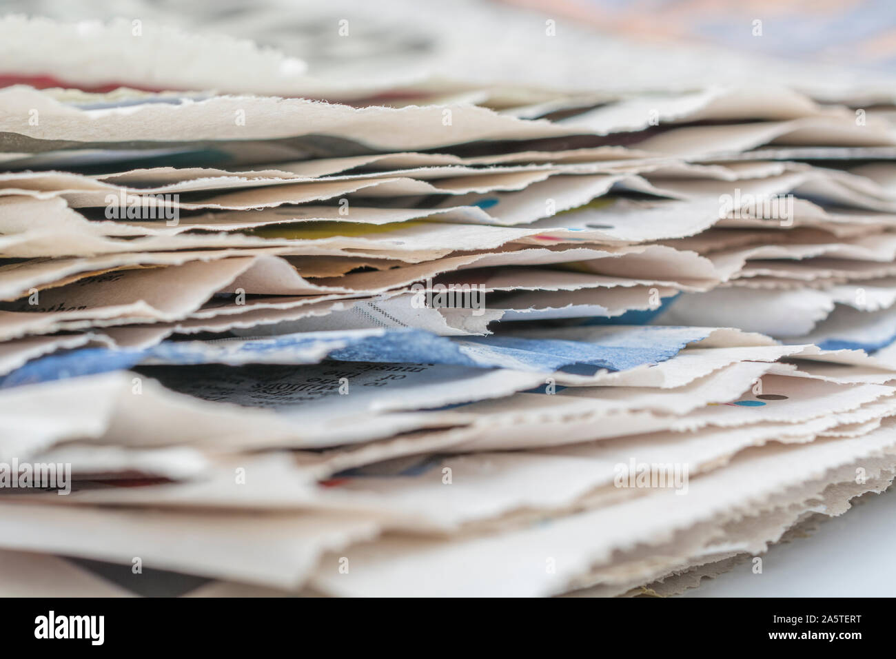 Old newspaper pages stacked. Traditional print media, front page news ...