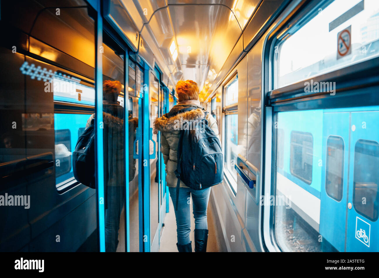 People traveling by train. They're driving in a wagon and a coupe. I ...