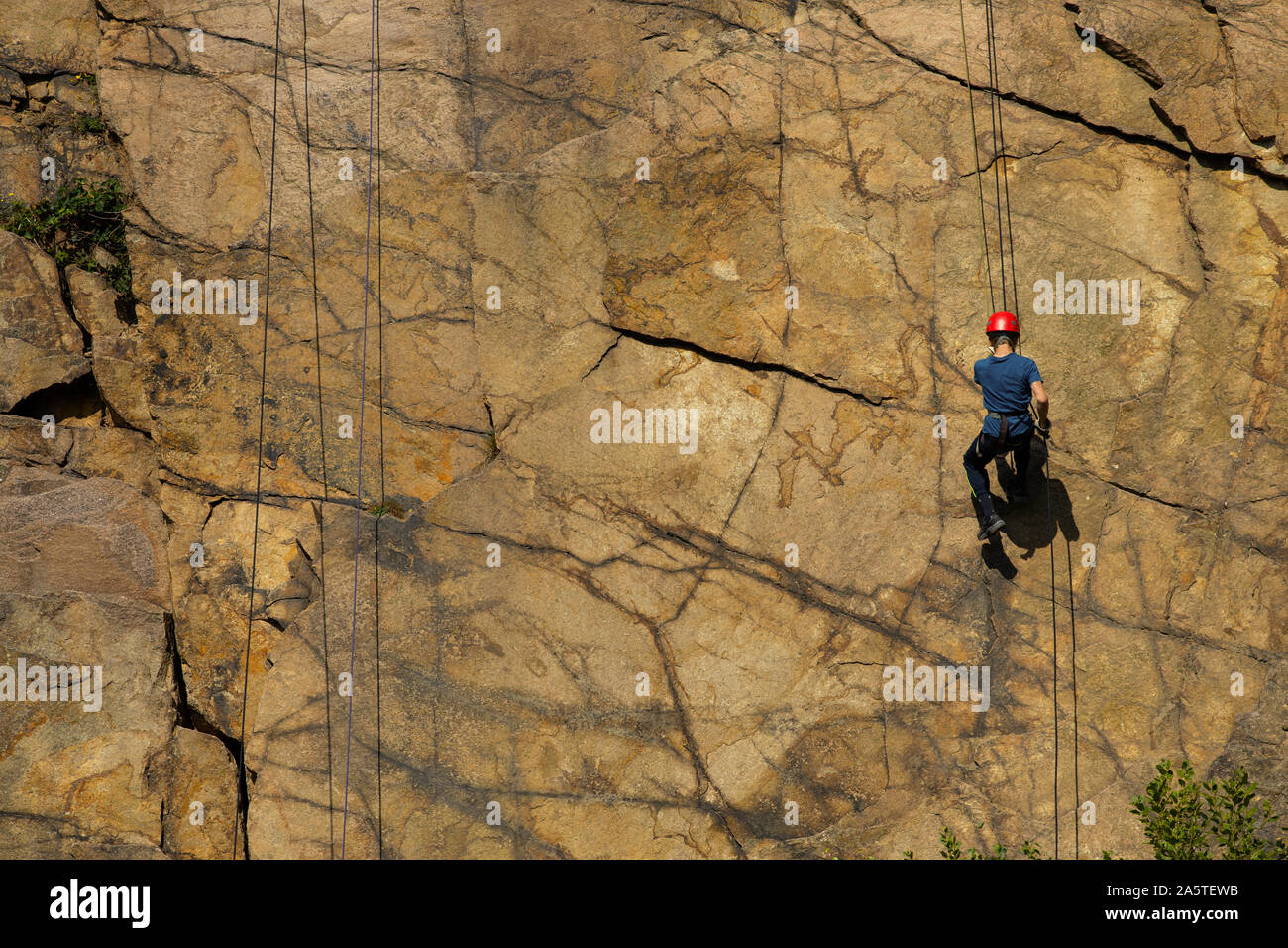 climber on the rock, Bornholm Stock Photo - Alamy