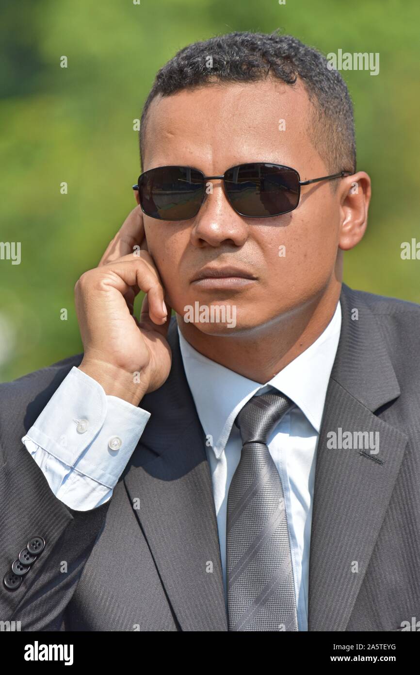 Security Guard Listening Wearing Suit And Tie Stock Photo - Alamy