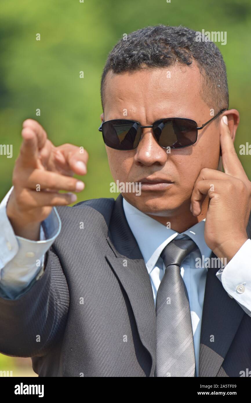 Diverse Security Guard Pointing Stock Photo - Alamy