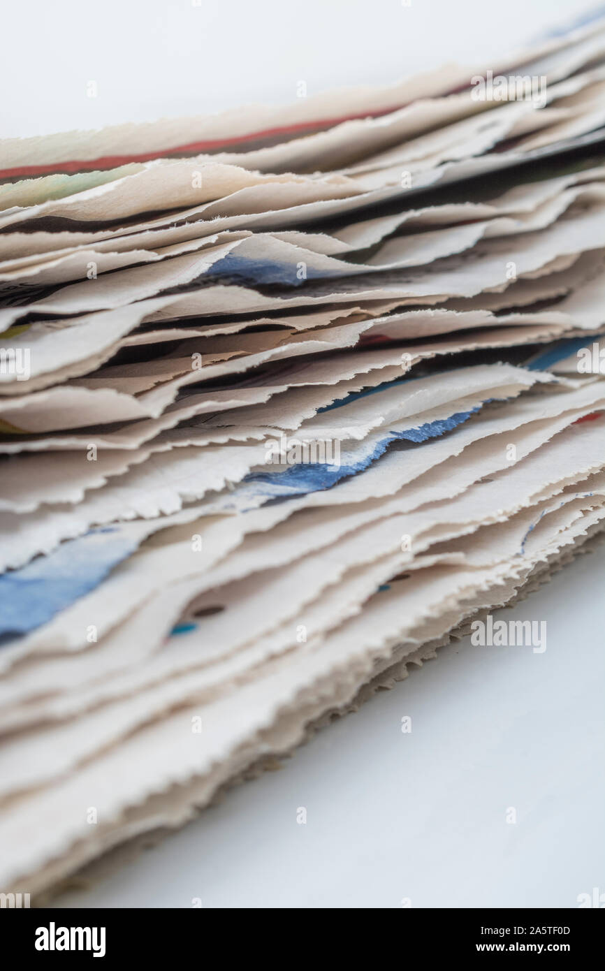 Old newspaper pages stacked. Traditional print media, front page news ...