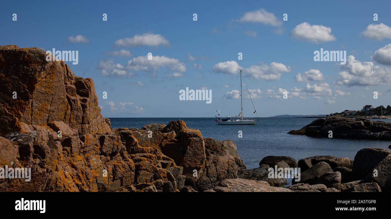 rocks and sea, sailboat, Sandvig, Bornholm Stock Photo - Alamy