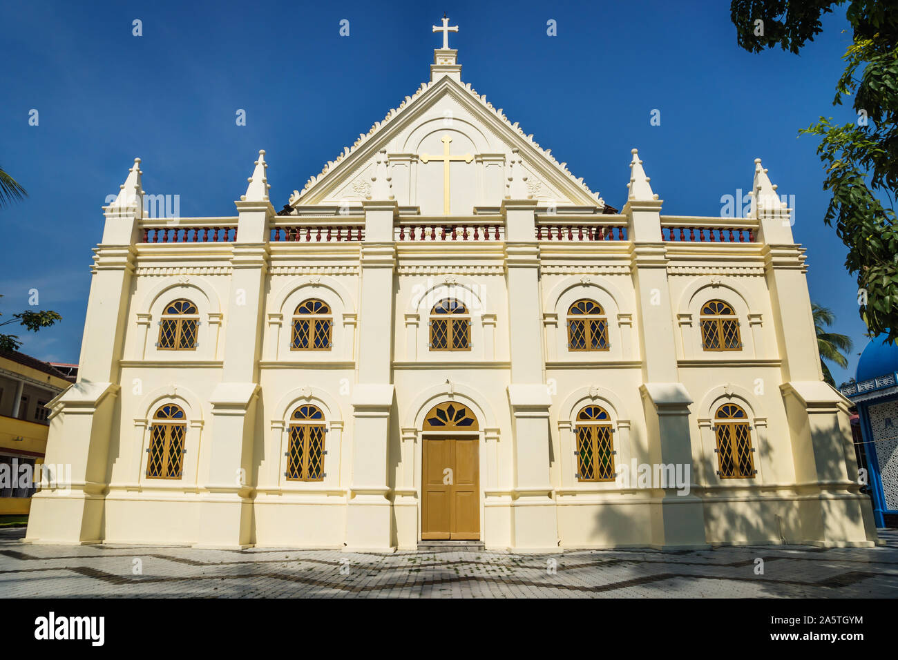 Front of Santa Cruz Cathedral Basilica white colonial church with blue ...