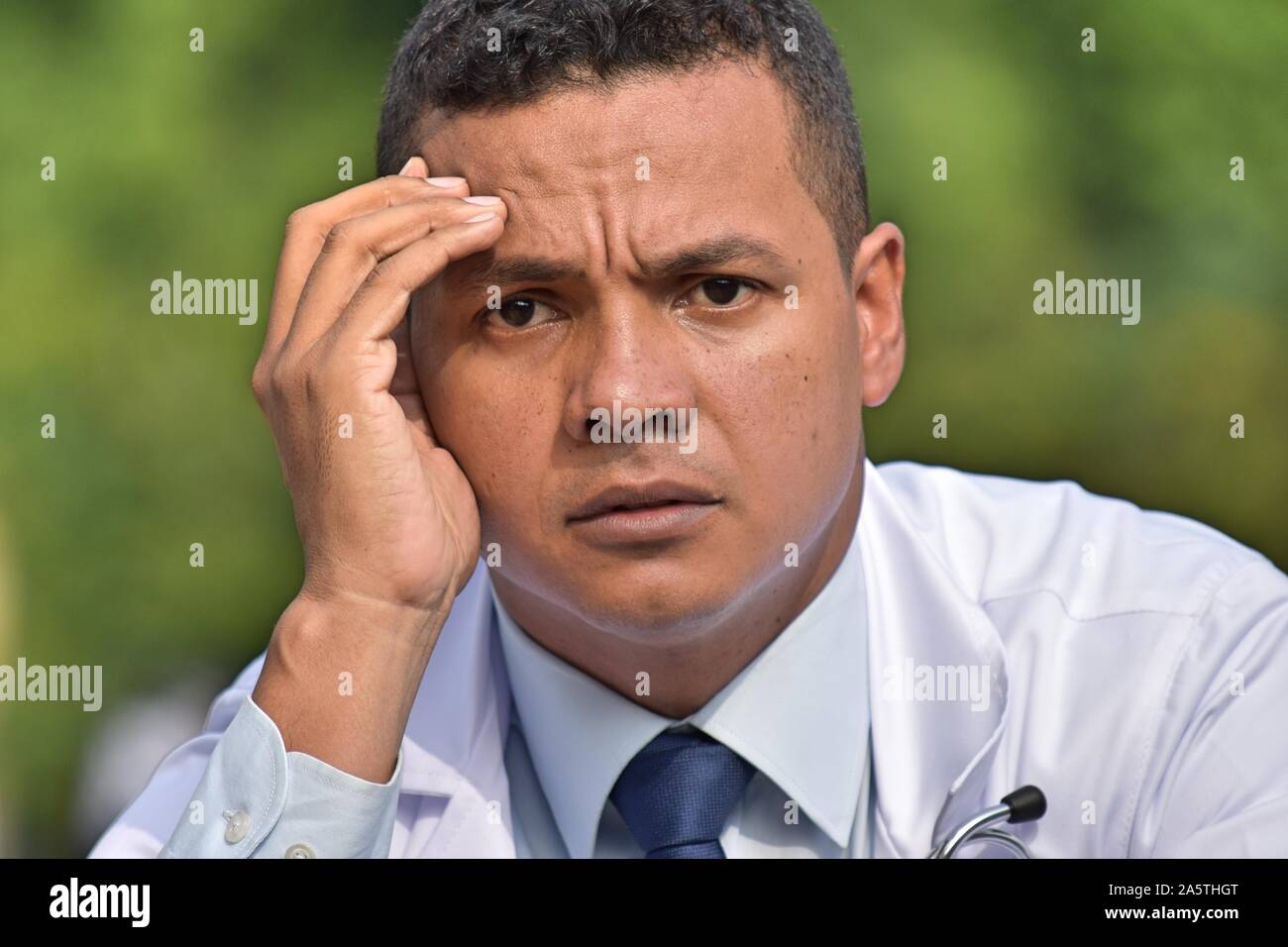 Male Doctor And Confusion Stock Photo - Alamy