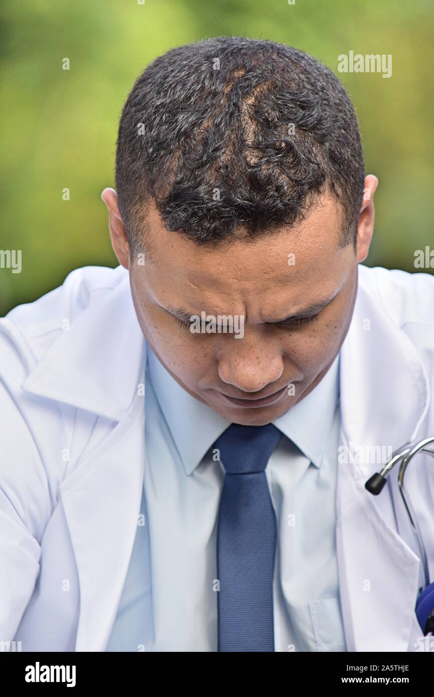 Sad Handsome Colombian Person Wearing Lab Coat Stock Photo - Alamy