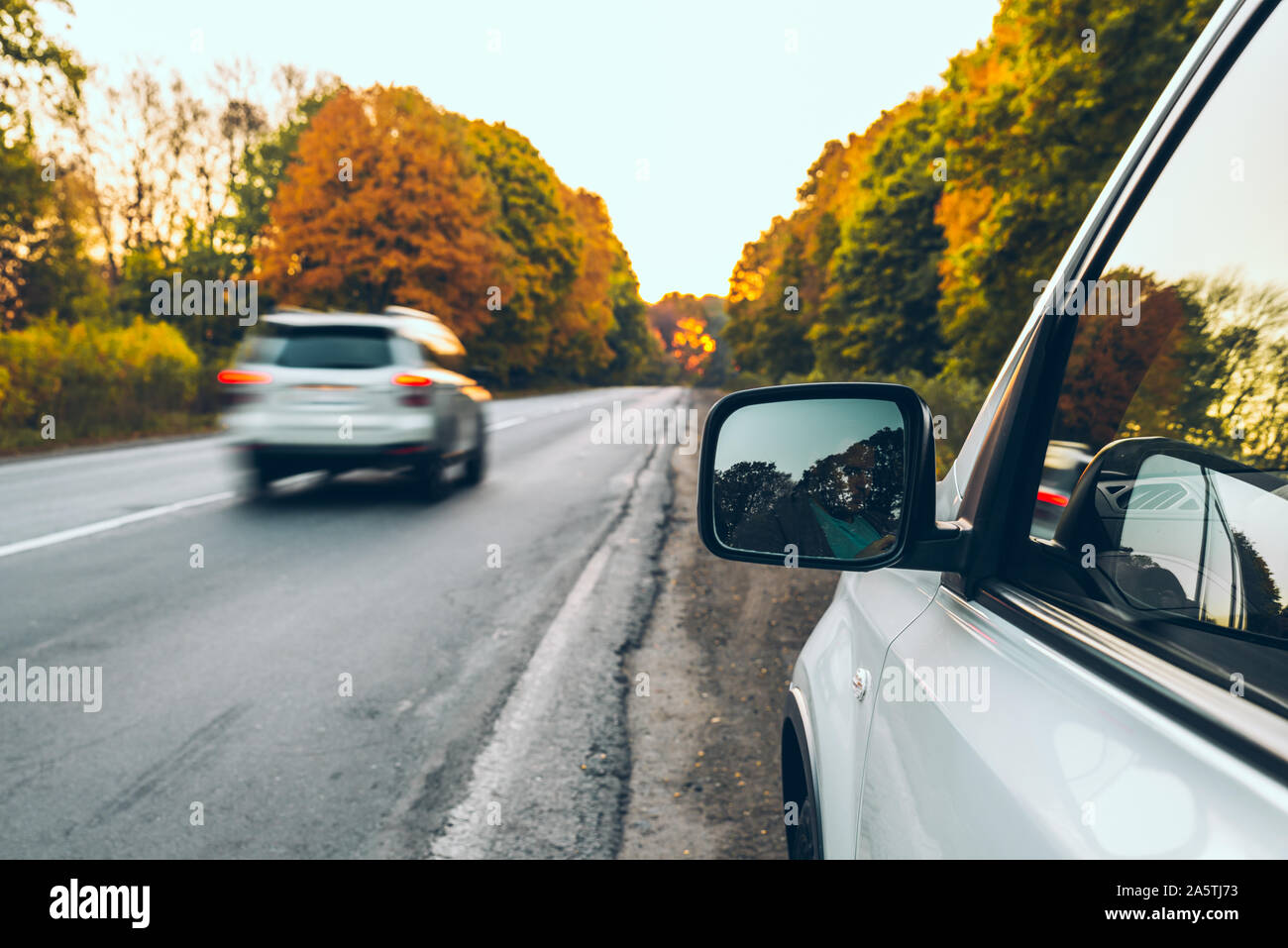 car at roadside of highway on sunrise Stock Photo - Alamy