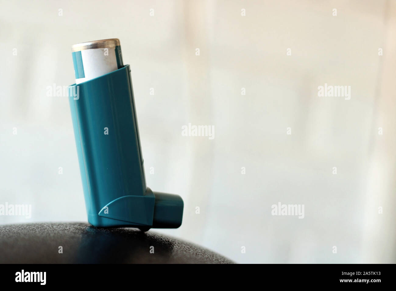 Medicine and health concept: Blue inhaler. Pharmaceutical product for ...