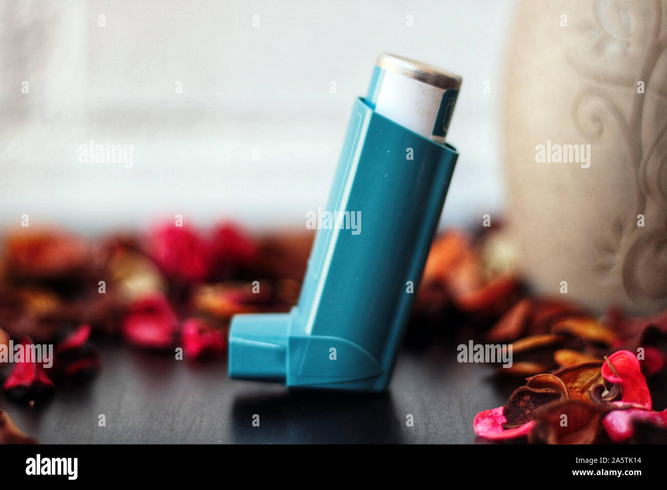 Medicine and health concept: Blue inhaler. Pharmaceutical product for ...