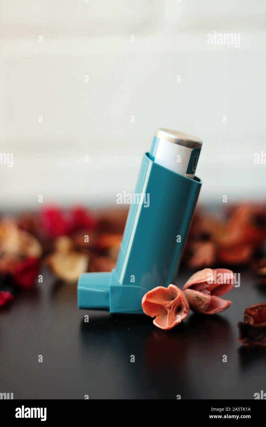 Medicine and health concept: Blue inhaler. Pharmaceutical product for ...