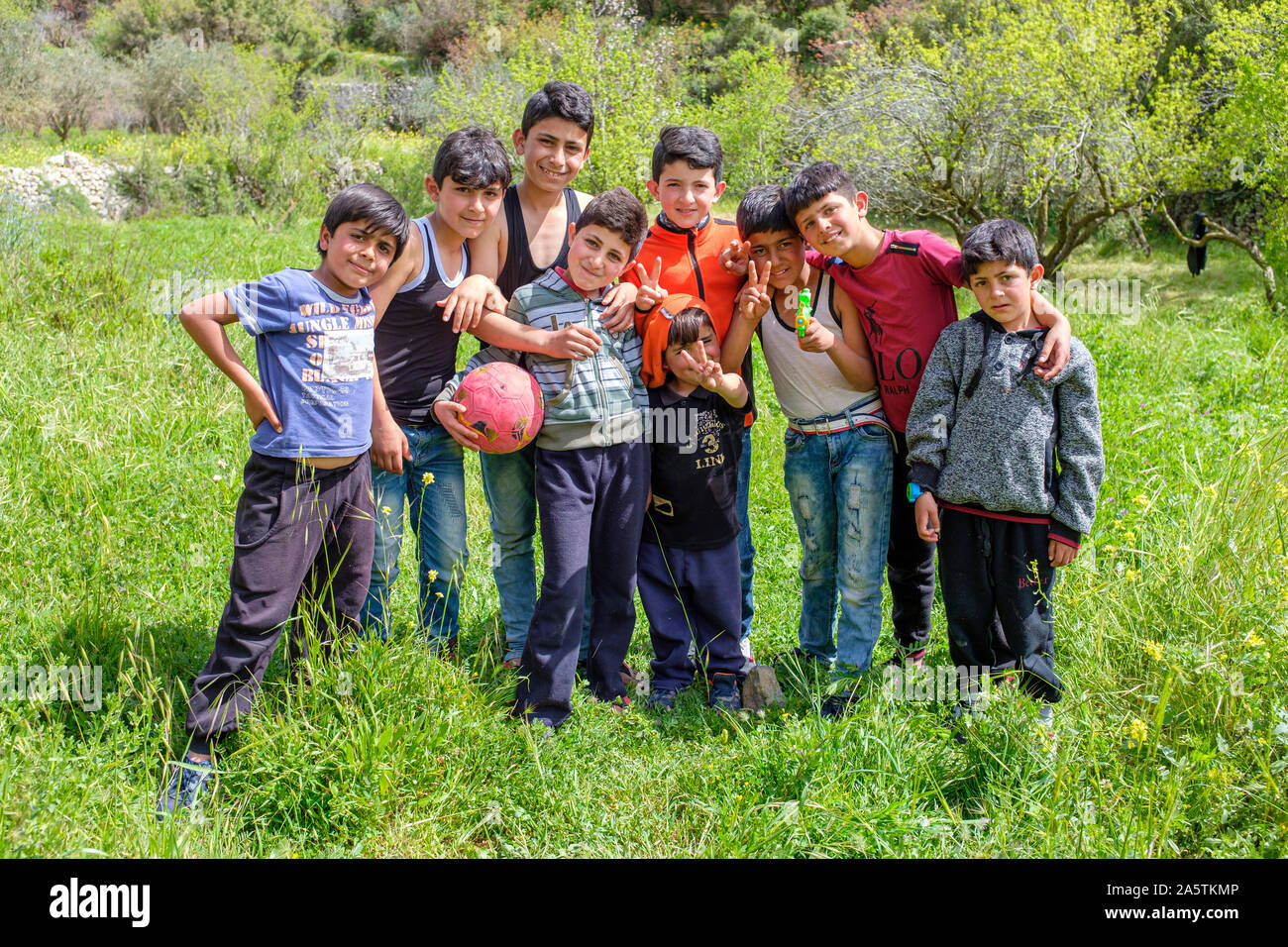 Palestinian children play in a field near Tapuah, Hebron Governorate, West Bank, Palestine Stock ...