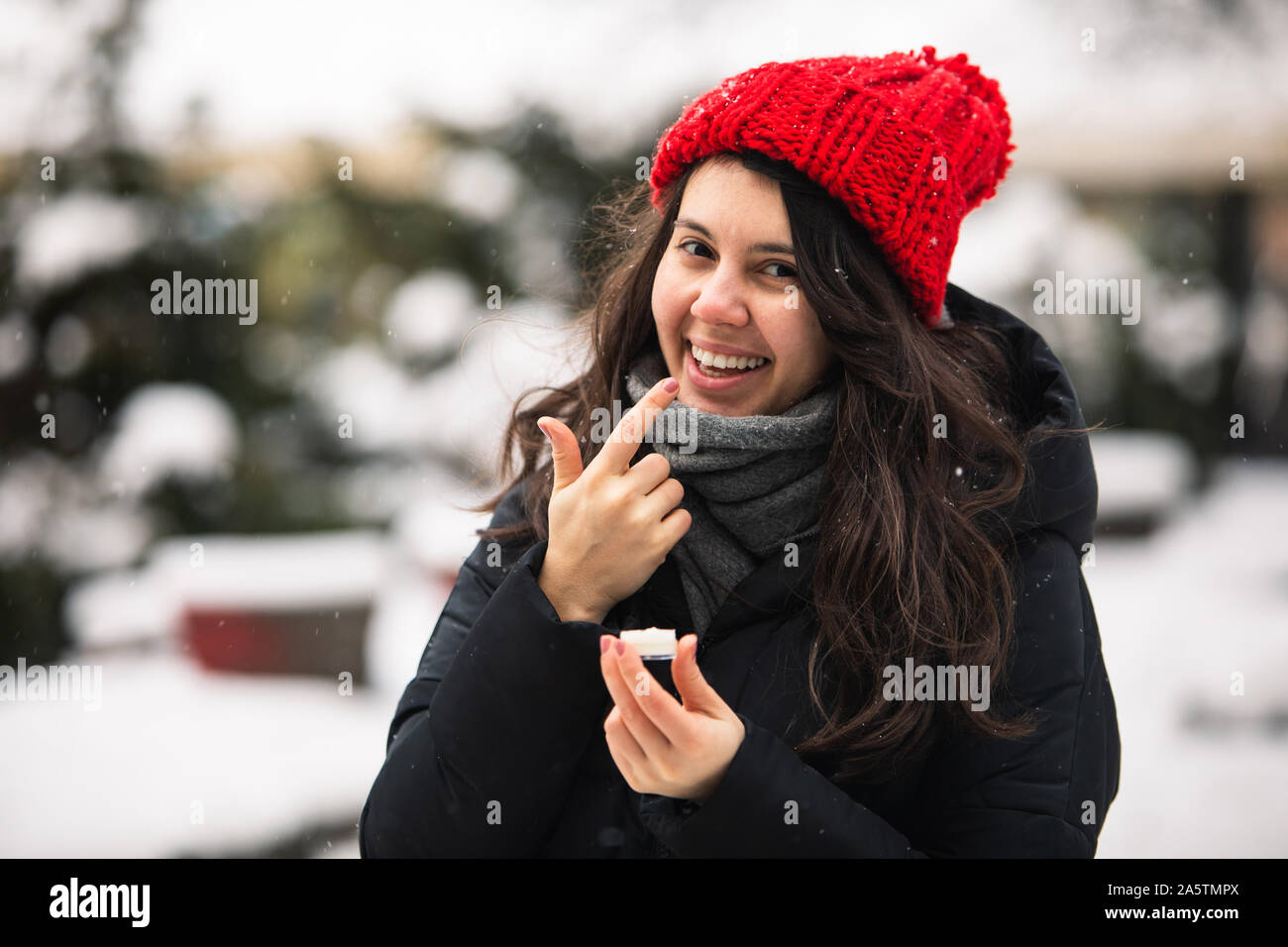 woman using cream at cold winter weather. skin protection Stock Photo ...