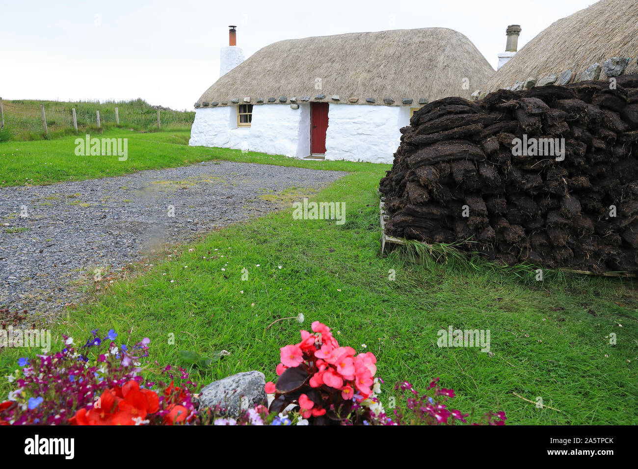 Traditional thatched croft, at Malacleit, on North Uist, in the Outer ...
