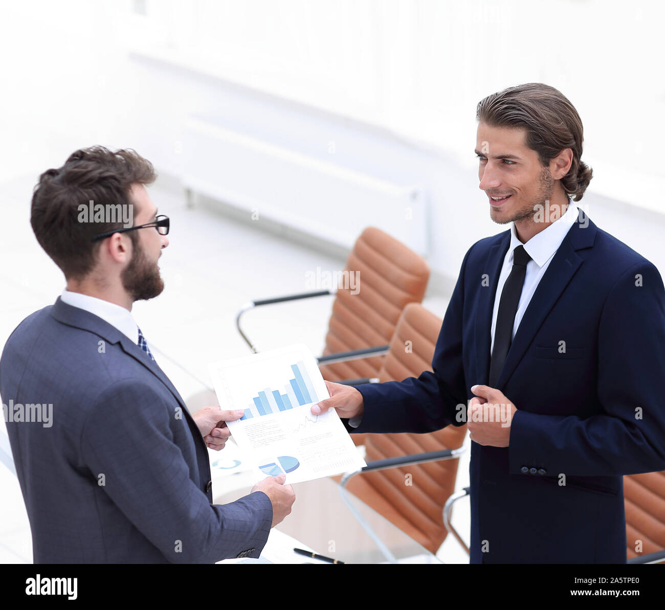 two businessmen talking in the office Stock Photo - Alamy
