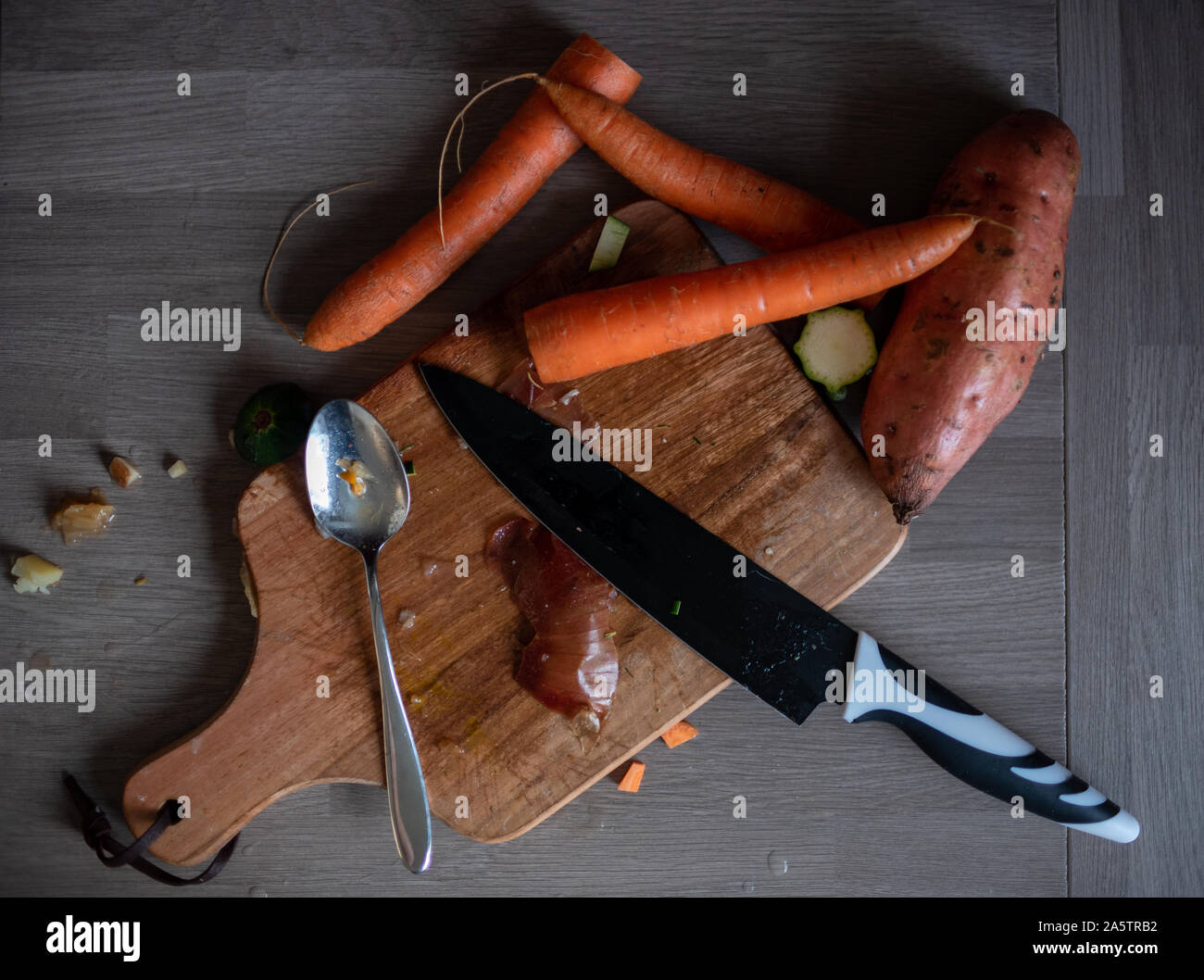 Messy soup ingredients on chopping board Stock Photo - Alamy