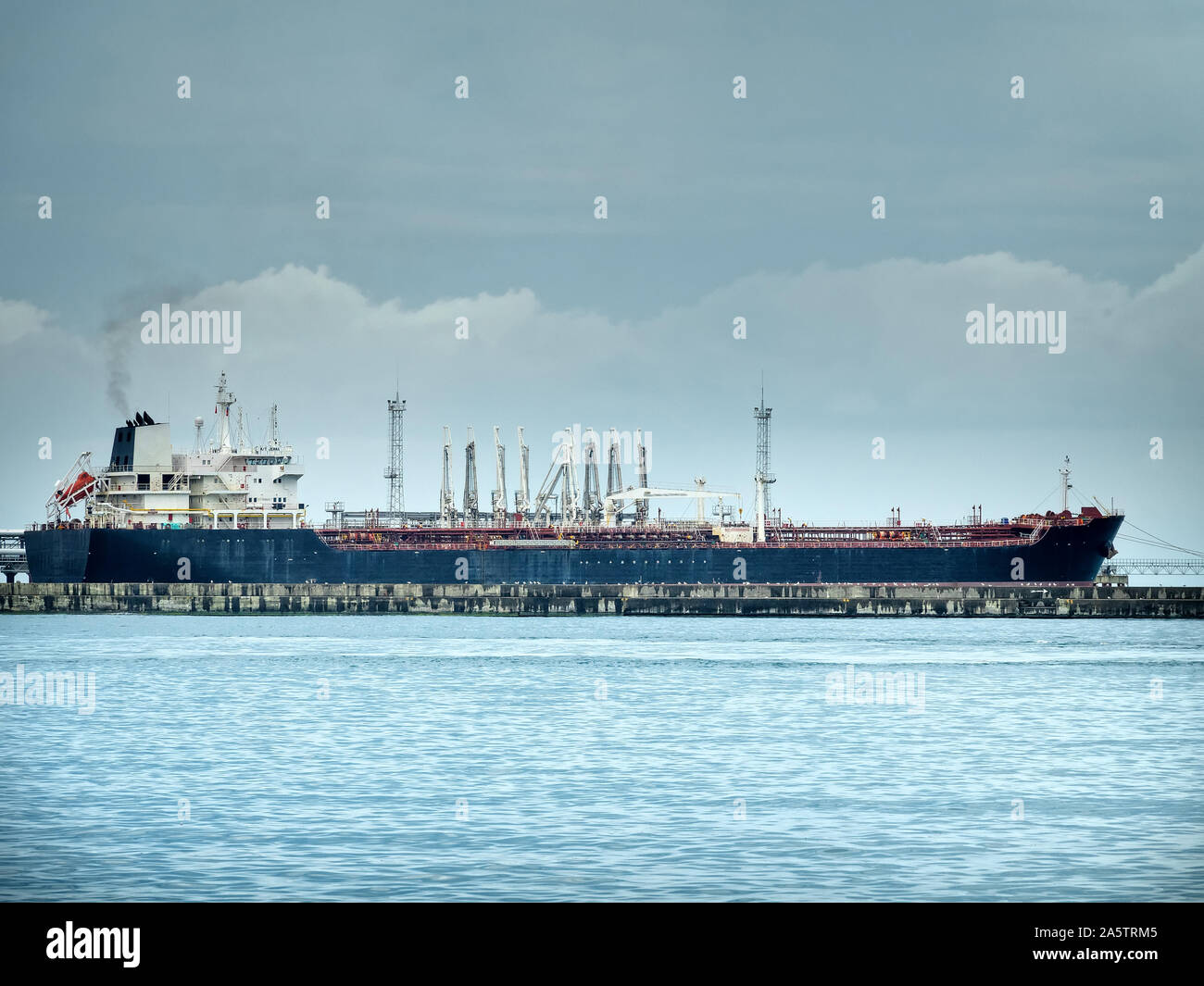 Oil vessel during filling with oil products. Rosneft oil company Stock ...