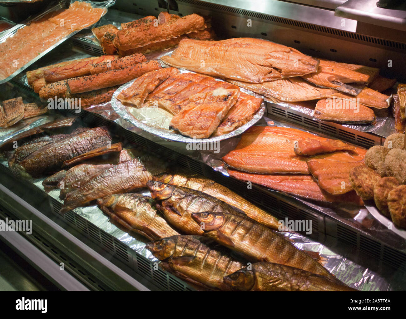 Traditional Finnish fish dishes. Fried fish on the counter of a market ...