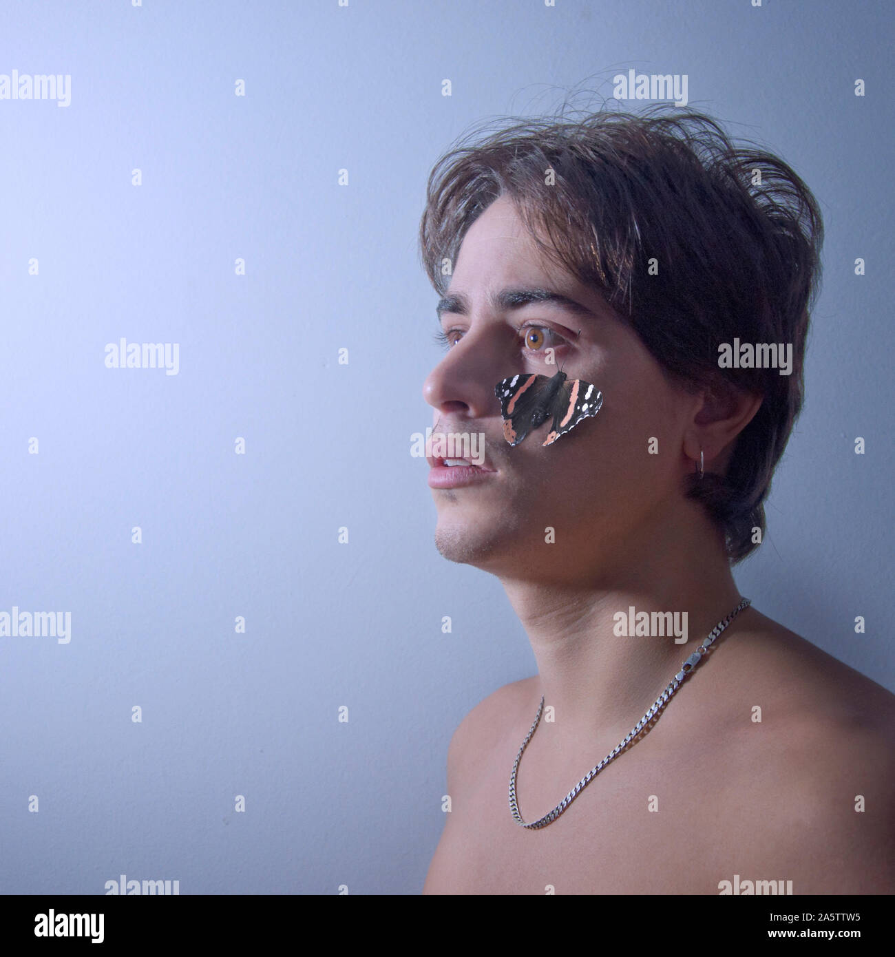 portrait of a man with a butterfly on his cheek Stock Photo - Alamy