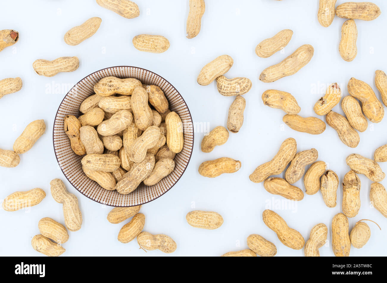 peanuts in shells in a bowl isolated on white background Stock Photo ...