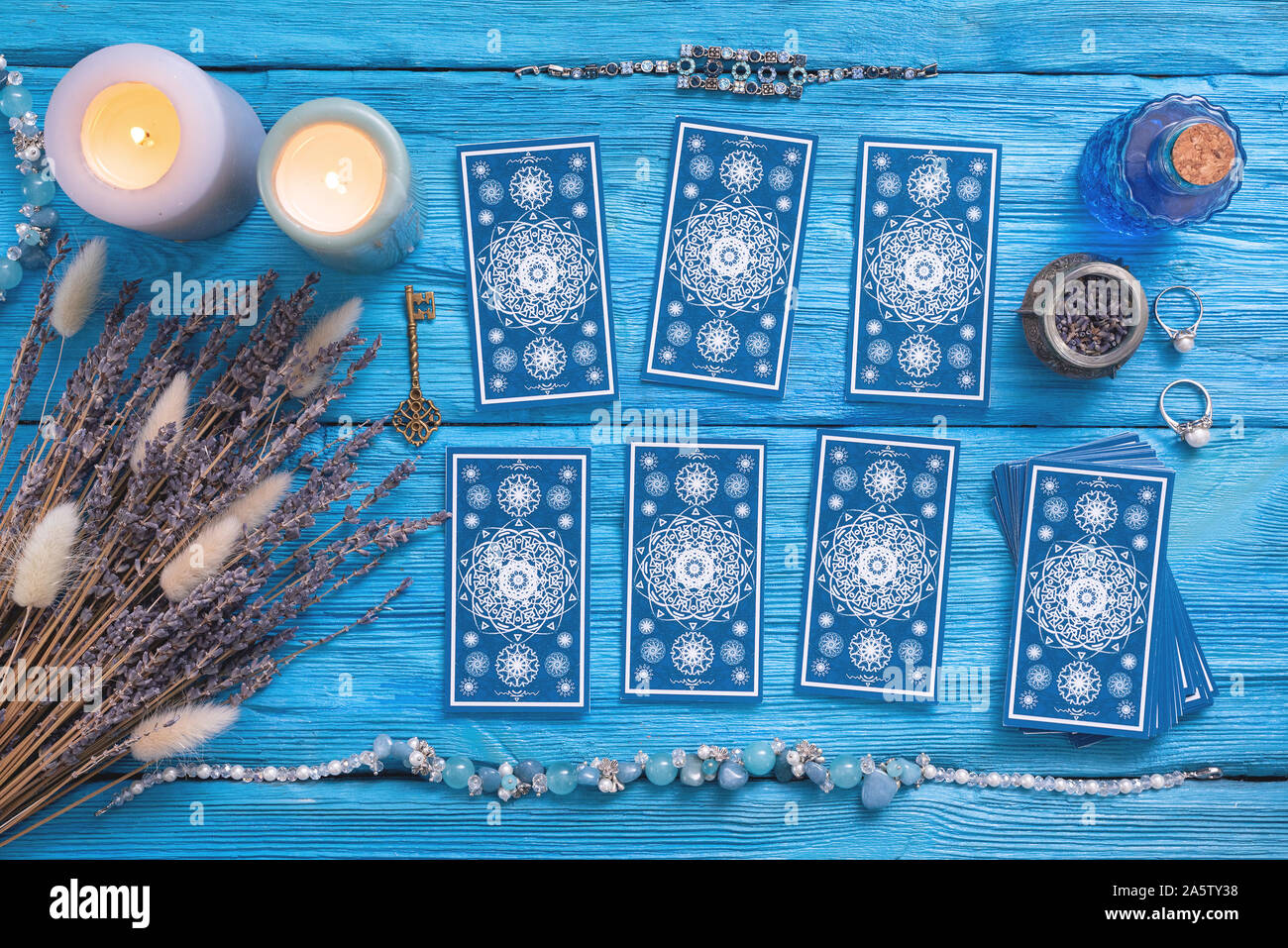 Blue tarot cards deck on blue wooden table flat lay background Stock ...