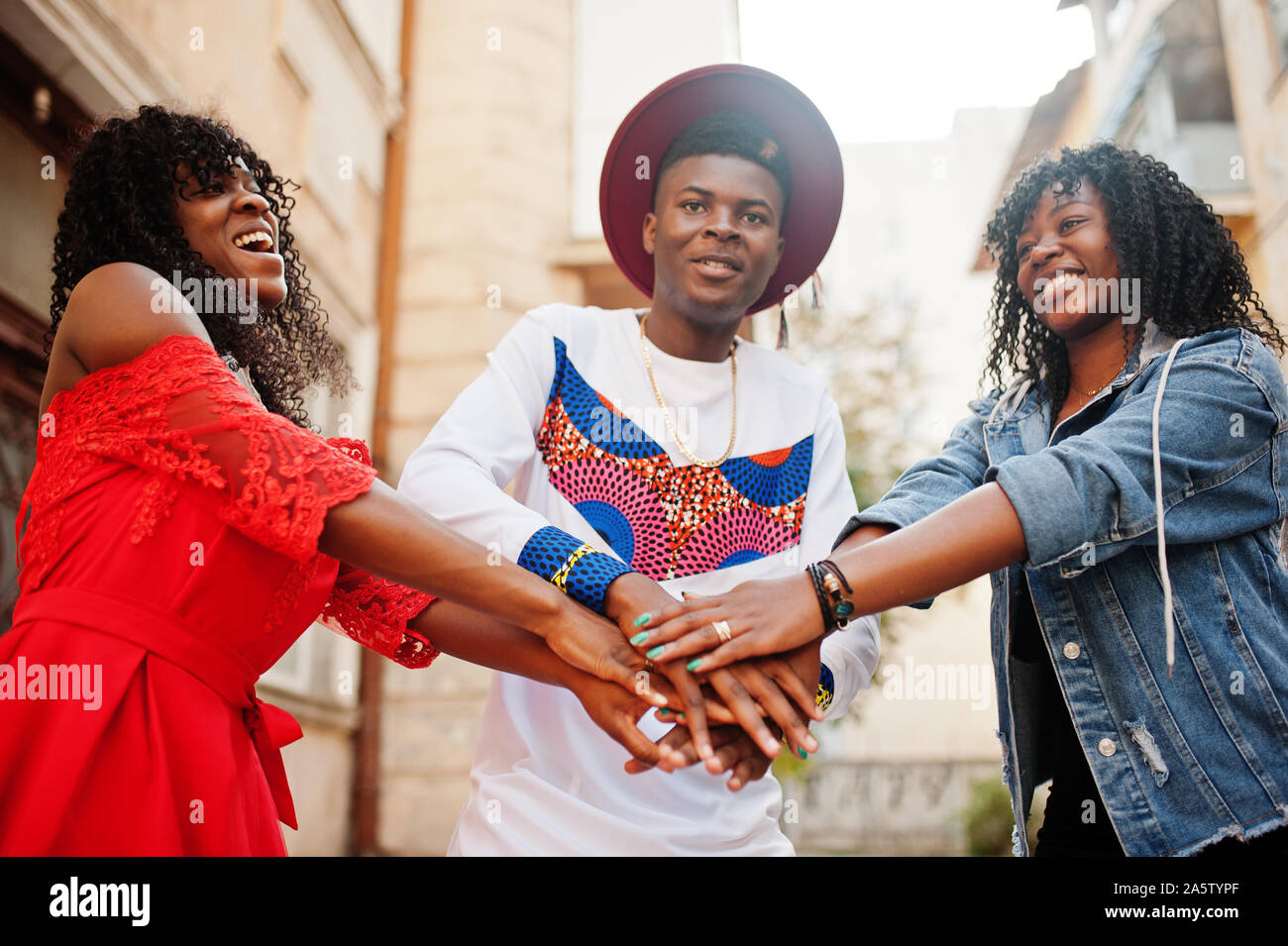 Group of three stylish trendy afro france friends posed at autumn day ...