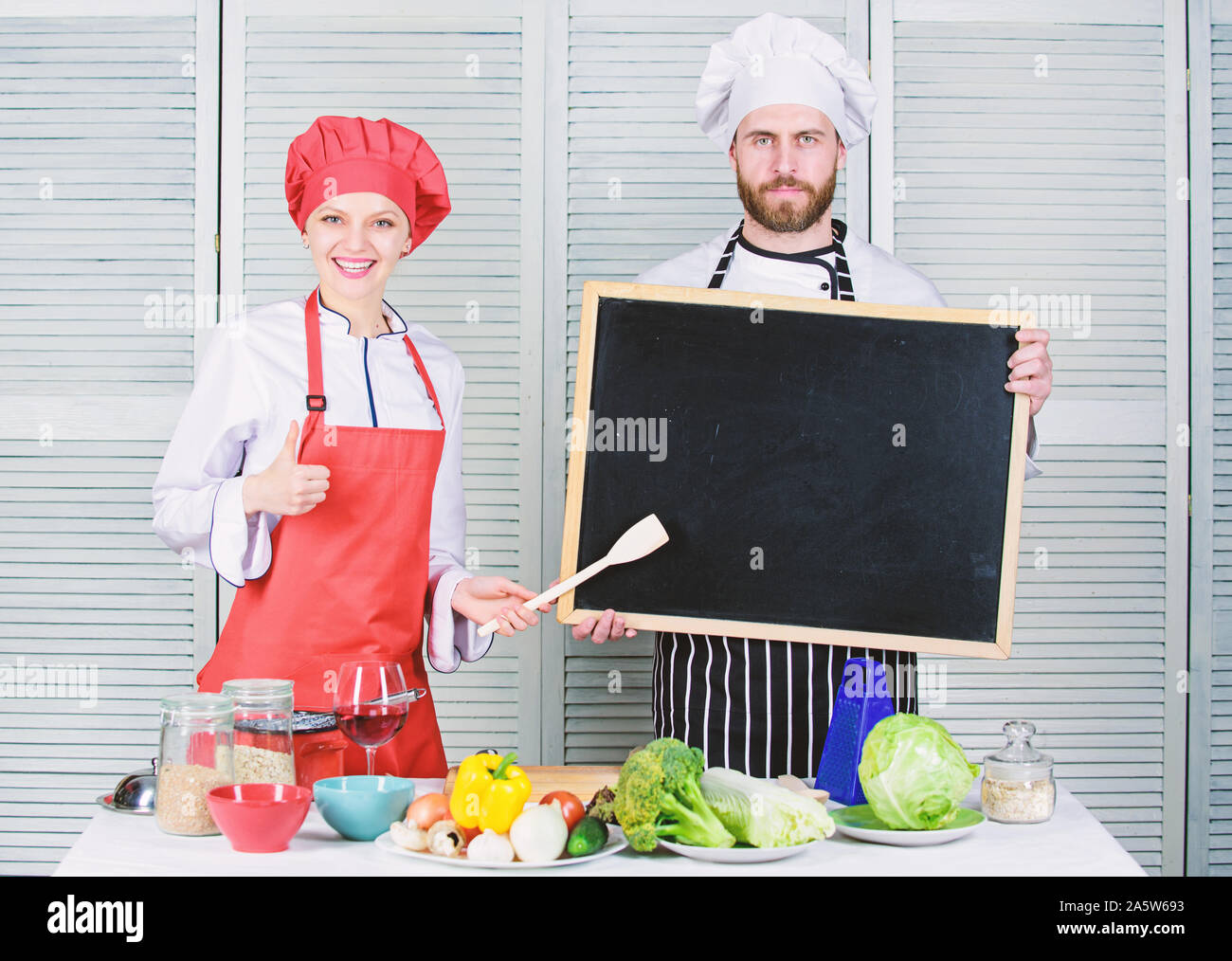 Hiring staff. Woman and man chef hold blackboard copy space. Job ...