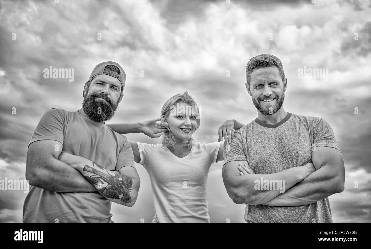 Woman and men look confident while stay close each other like team ...