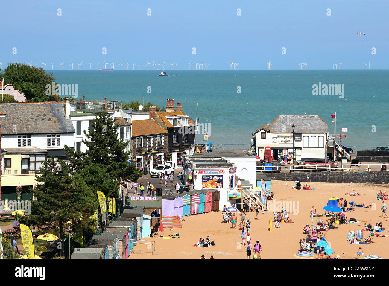 People enjoying the beach at Broadstairs and its seafront amenities ...