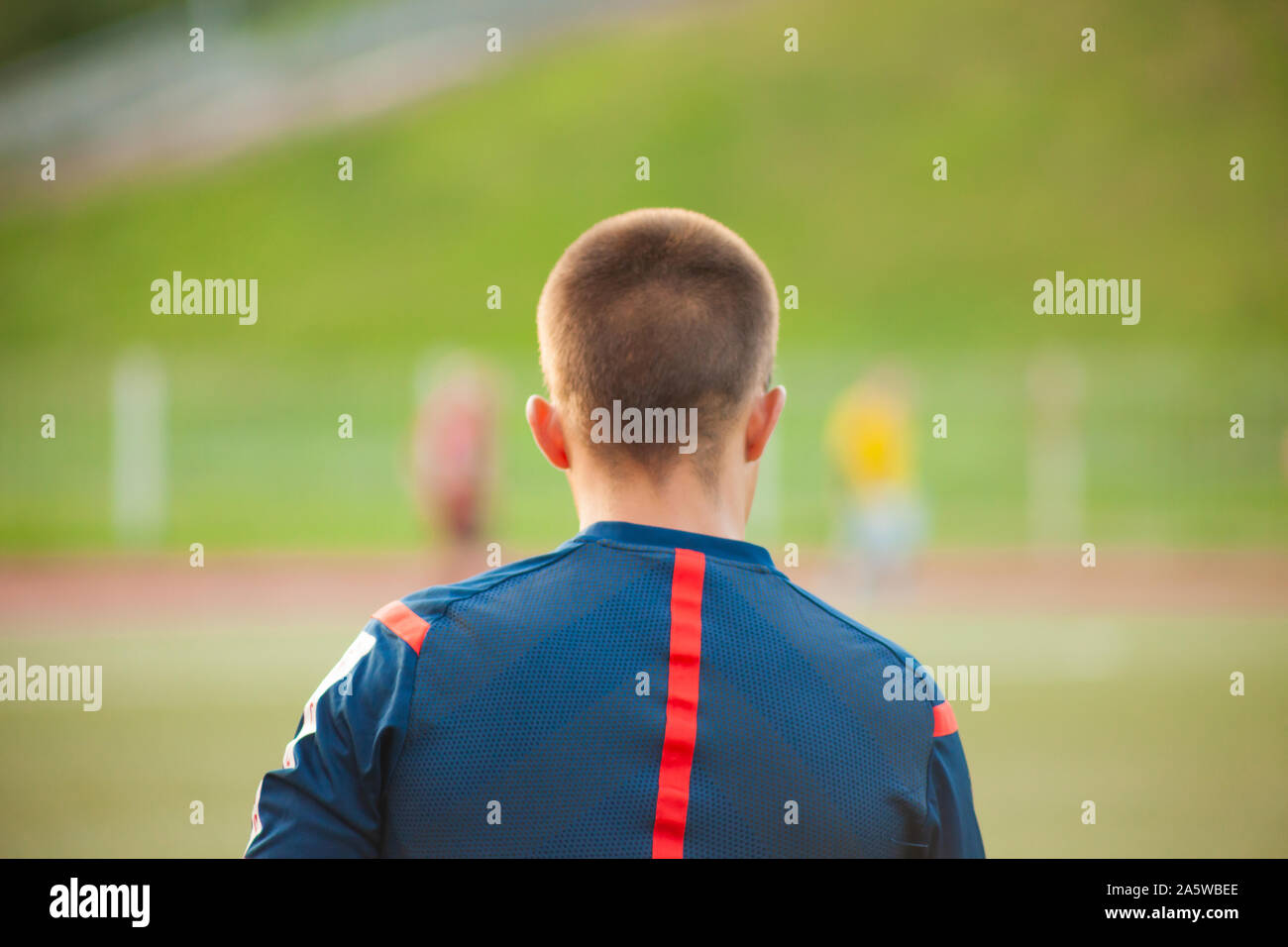 Assistant soccer referee standing with his back against the backdrop of ...