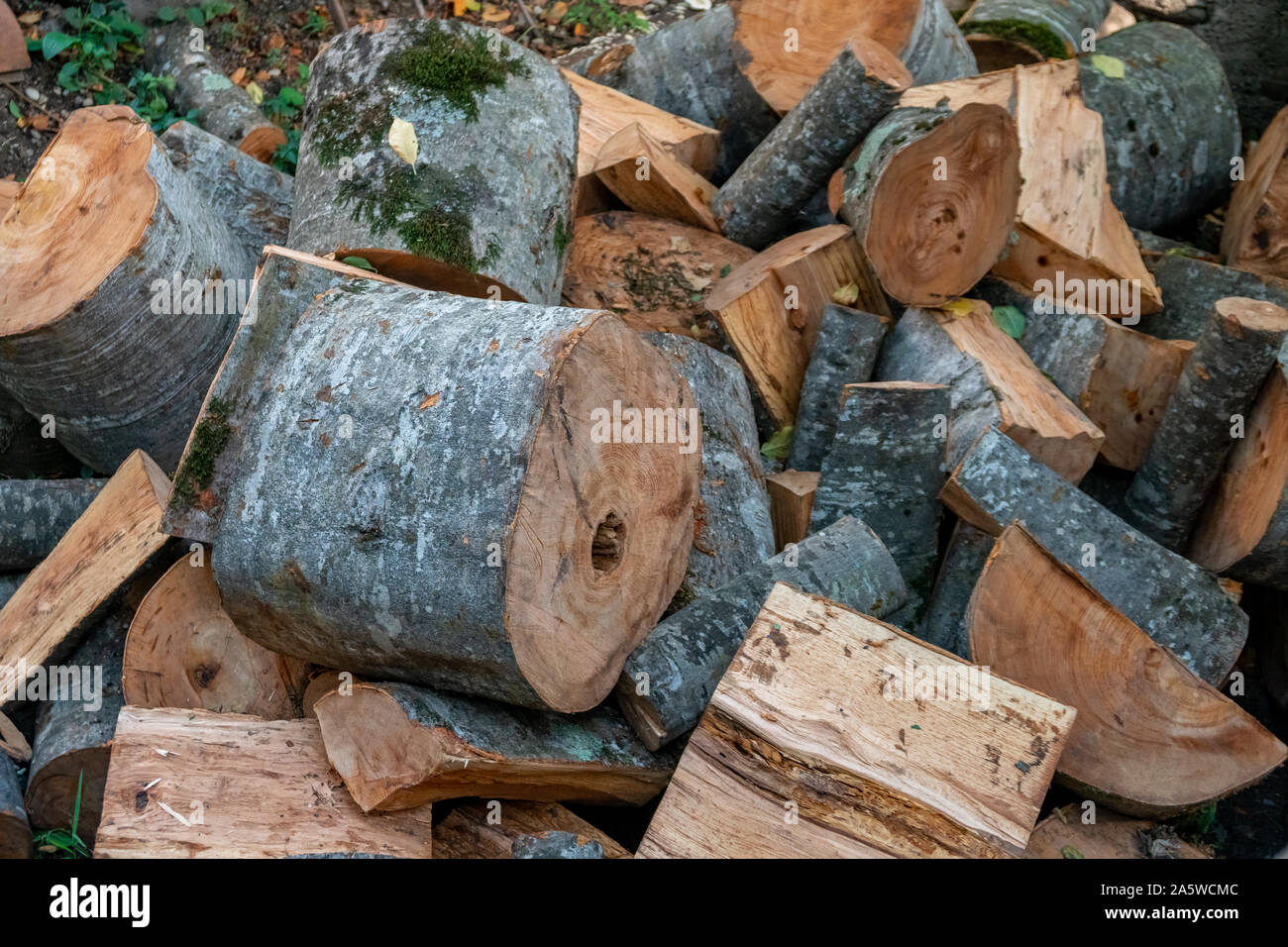 Preparation of firewood for the winter. firewood background, Stacks of ...