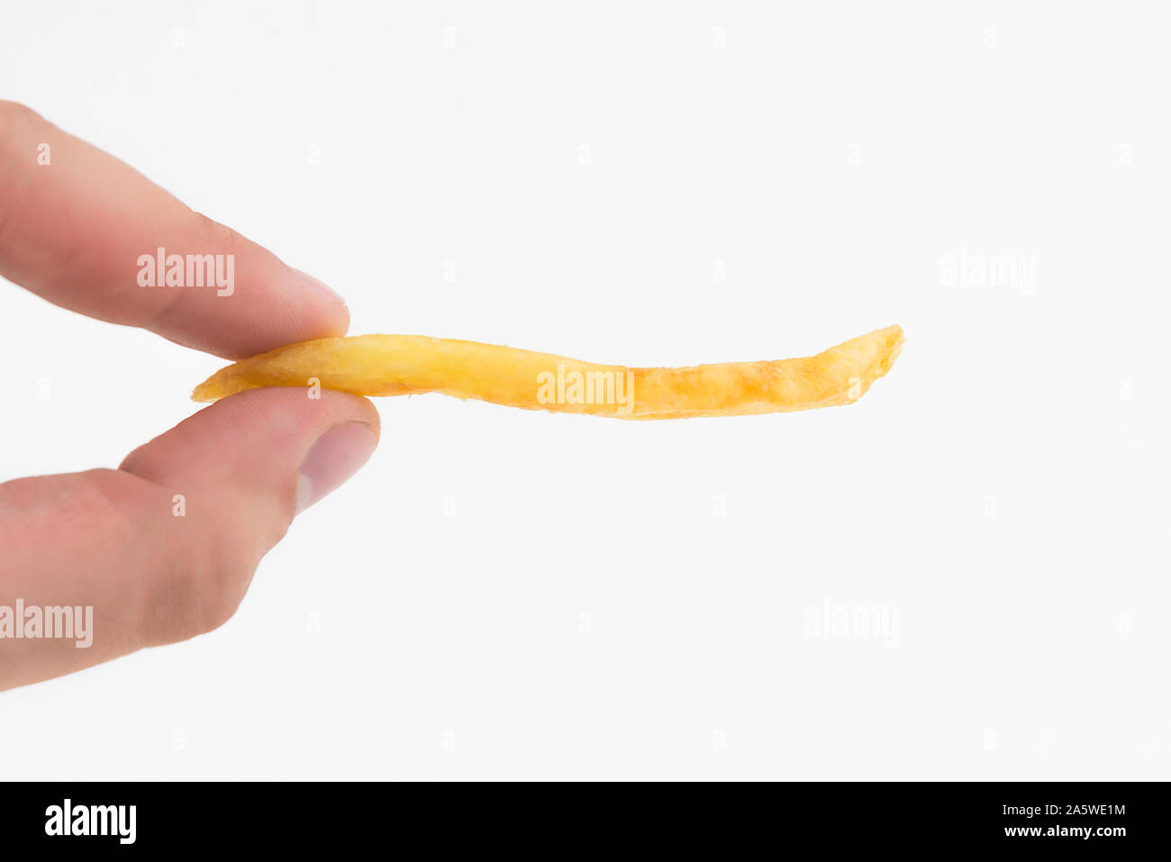 french fries in the fingers isolated on white background. Suitable for ...