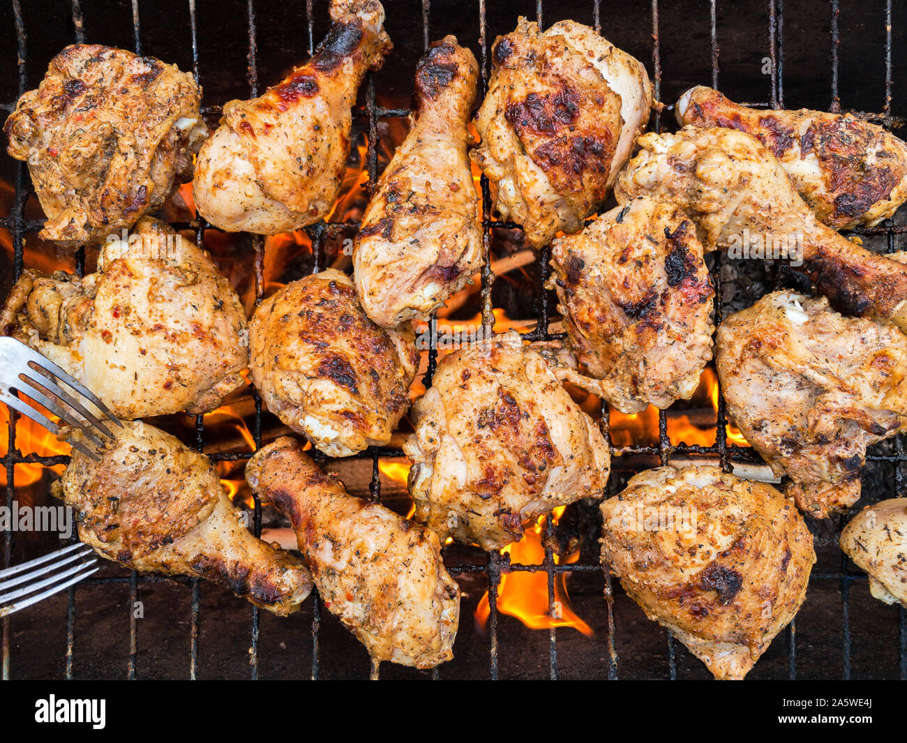 Chicken legs on the grill with smoke Stock Photo - Alamy