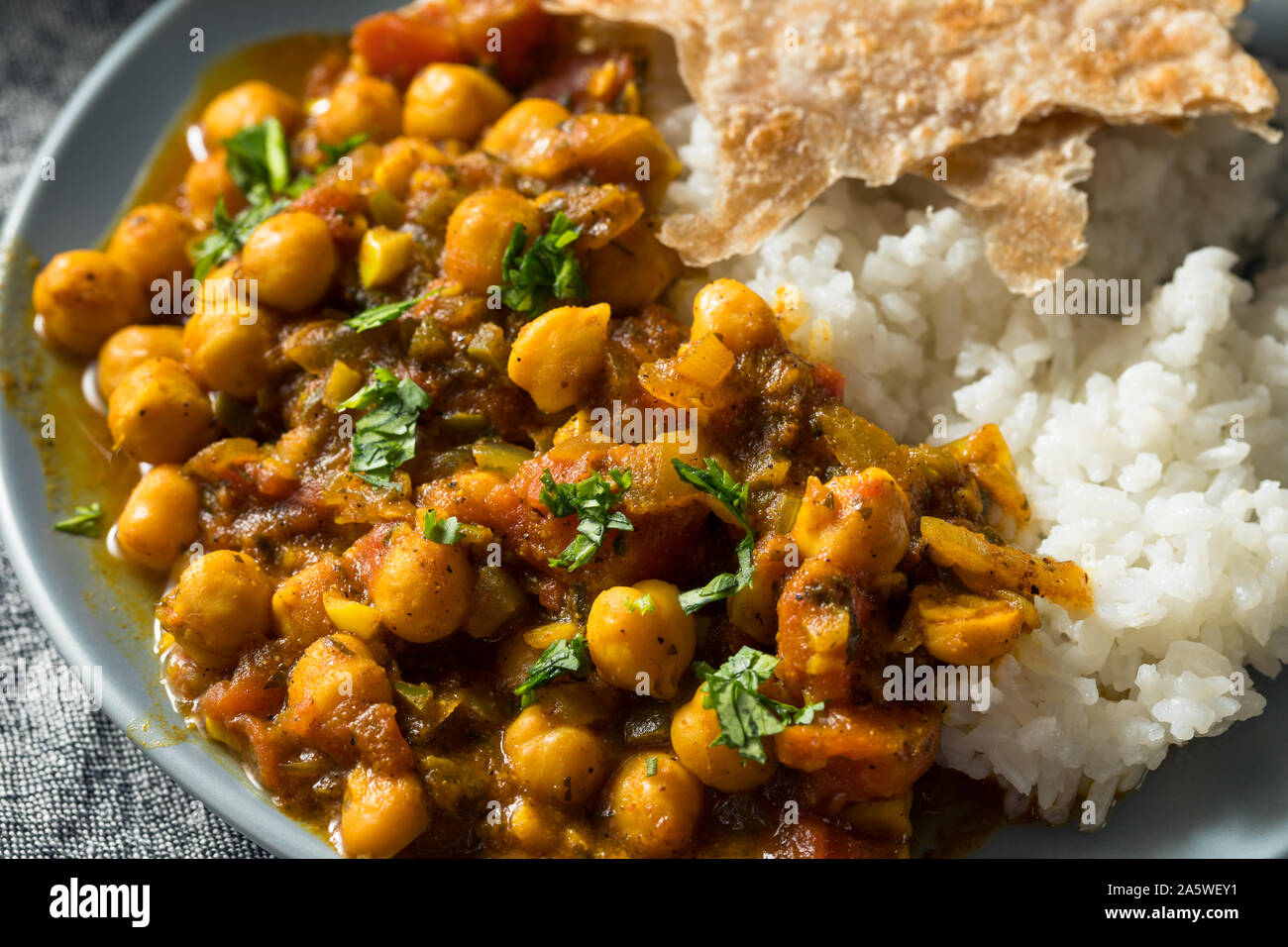 Homemade Indian Chickpea Chana Masala with Rice and Roti Stock Photo ...
