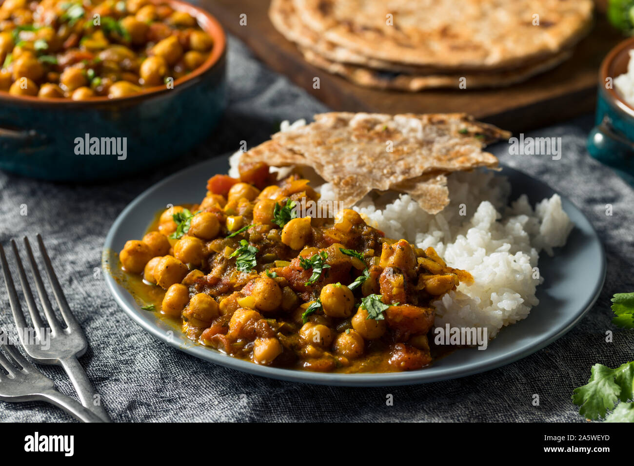 Homemade Indian Chickpea Chana Masala with Rice and Roti Stock Photo ...