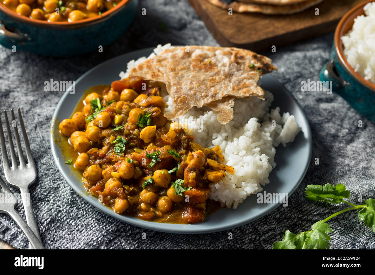 Homemade Indian Chickpea Chana Masala with Rice and Roti Stock Photo ...