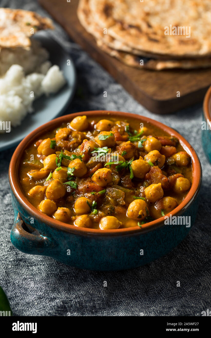 Homemade Indian Chickpea Chana Masala with Rice and Roti Stock Photo ...