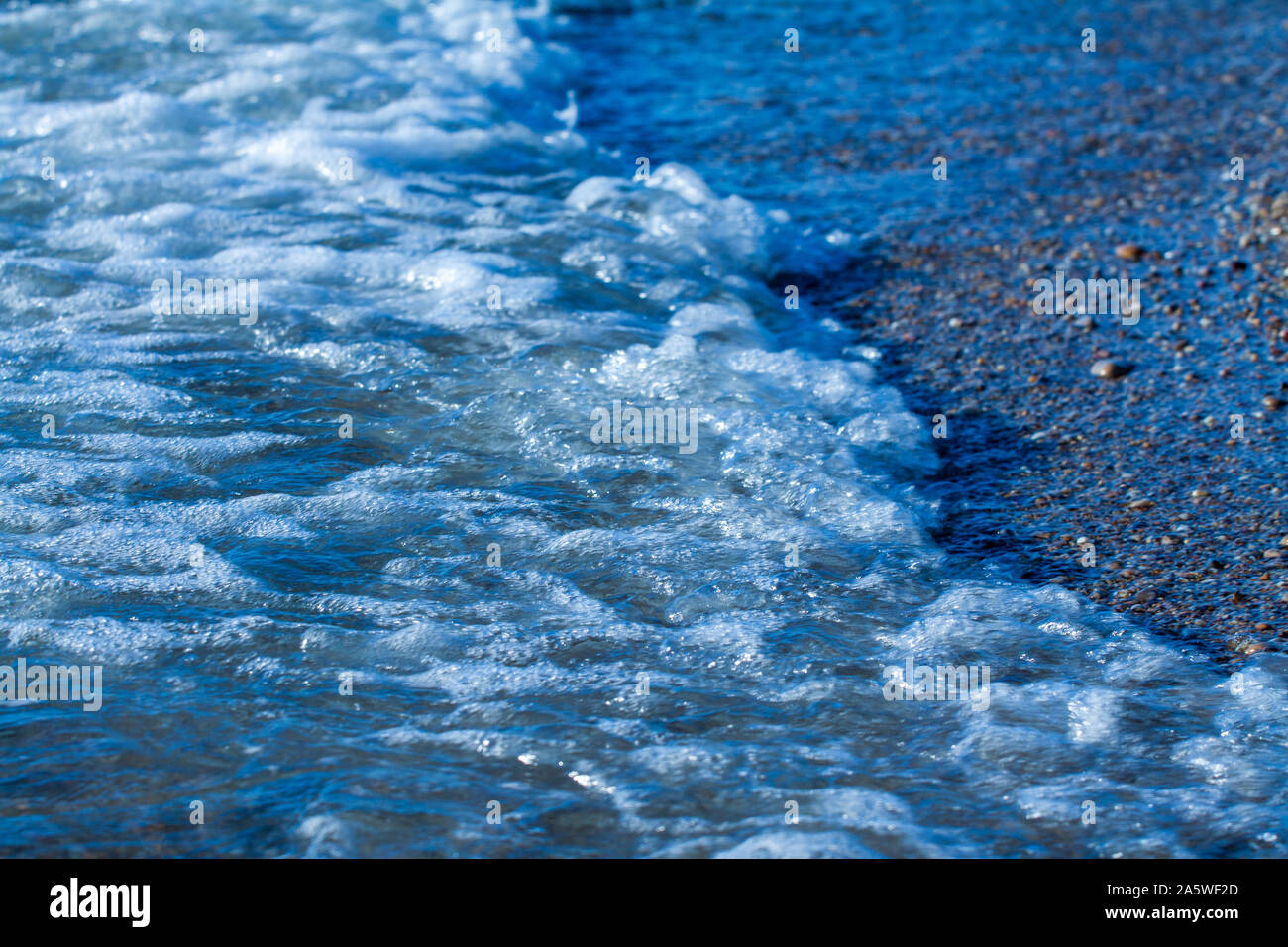 sea pebbles colored granite on the beach background stones. The shore ...