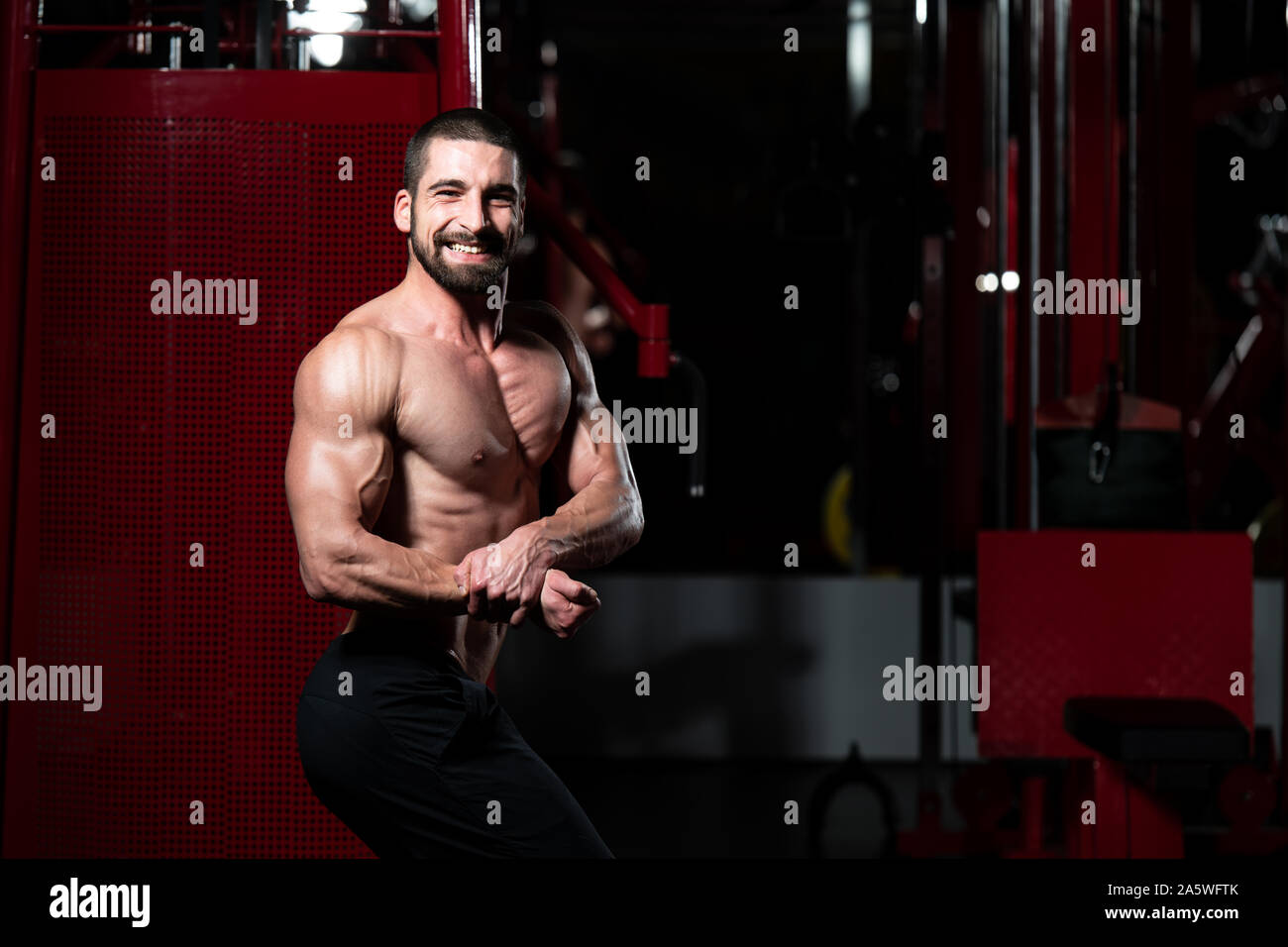 Portrait Of A Young Physically Fit Man Showing His Well Trained Body ...