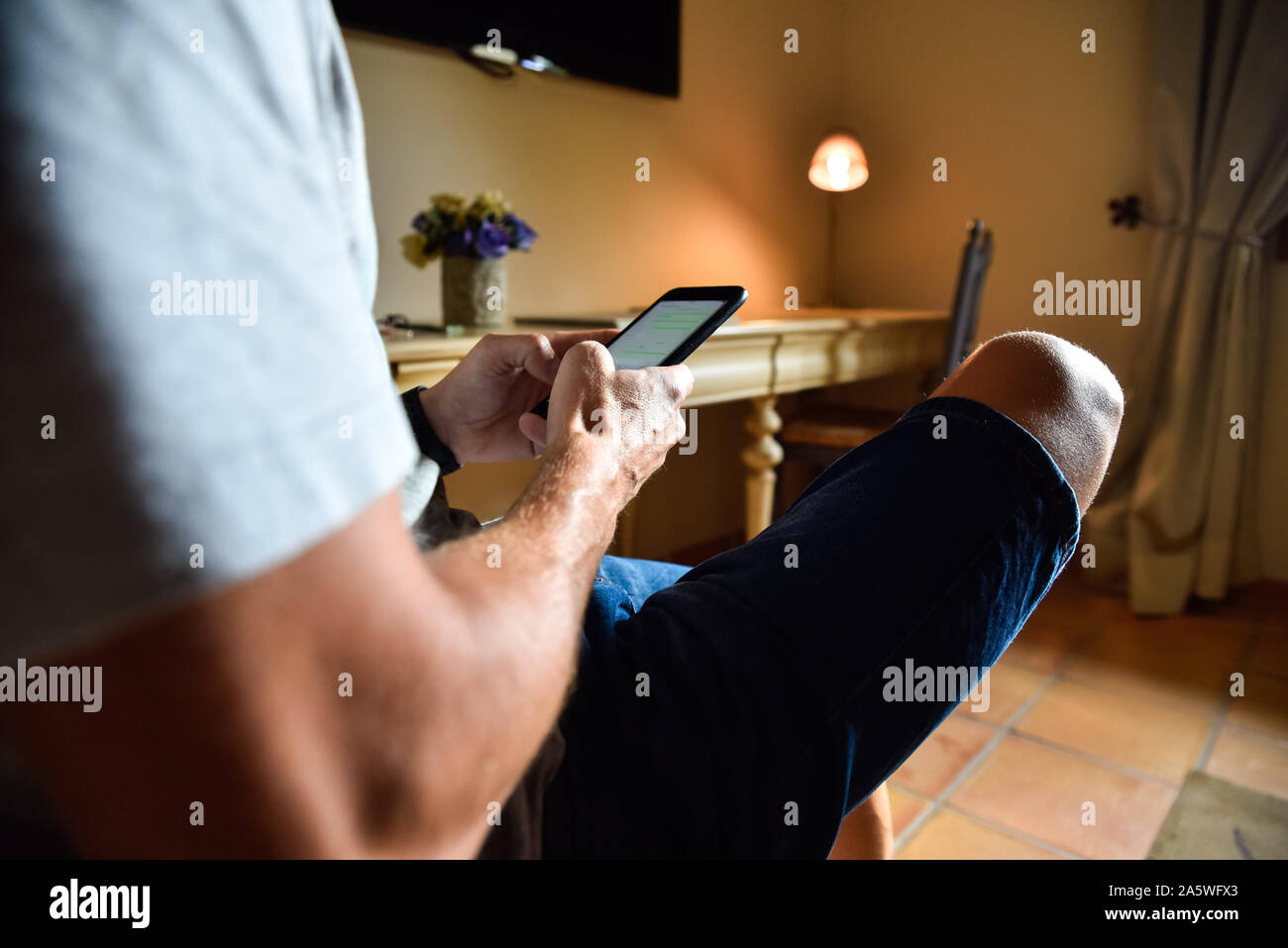 Working remotely with cell phone hi-res stock photography and images ...