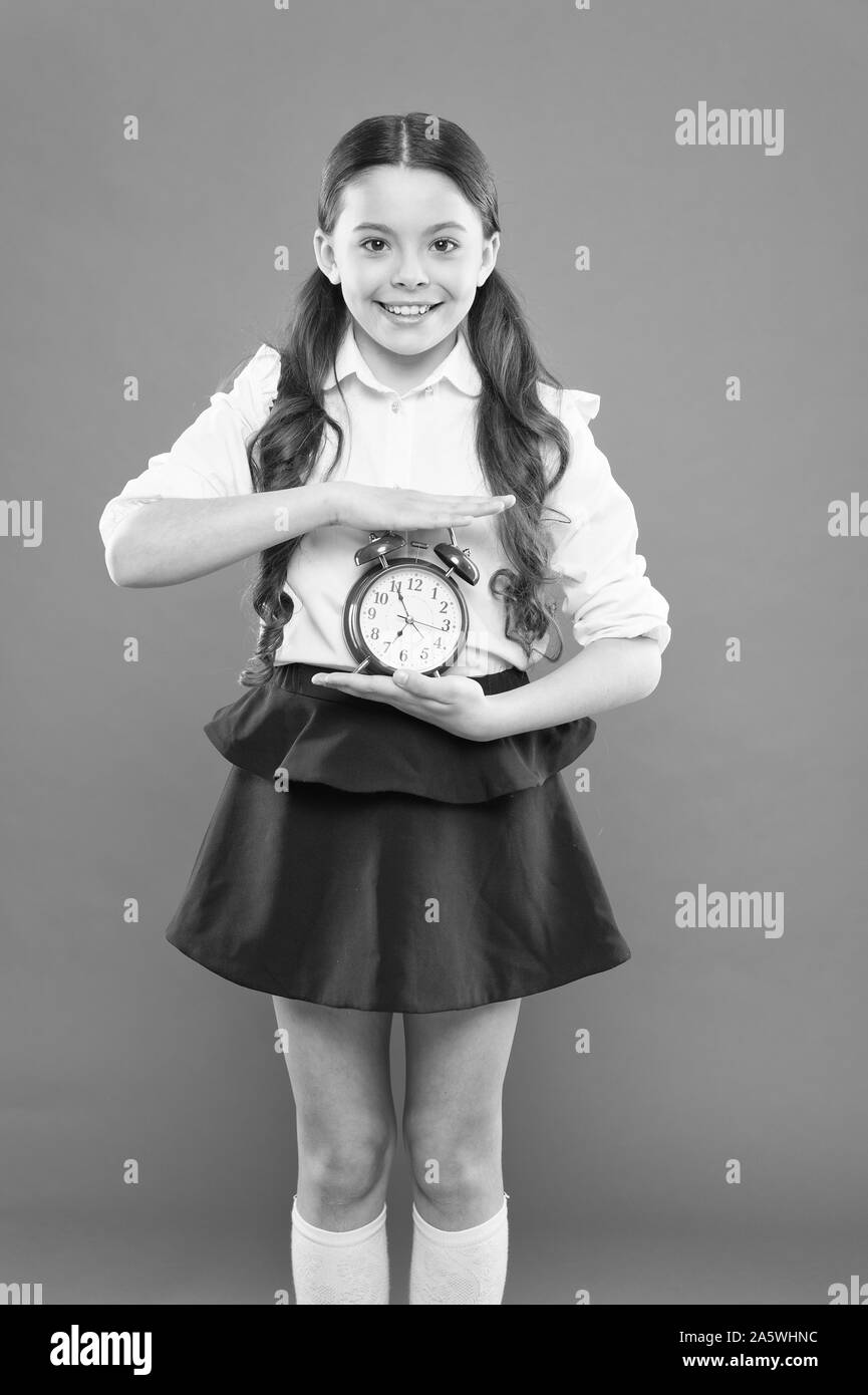 Day time. daily routine schedule. schoolgirl and retro alarm clock ...