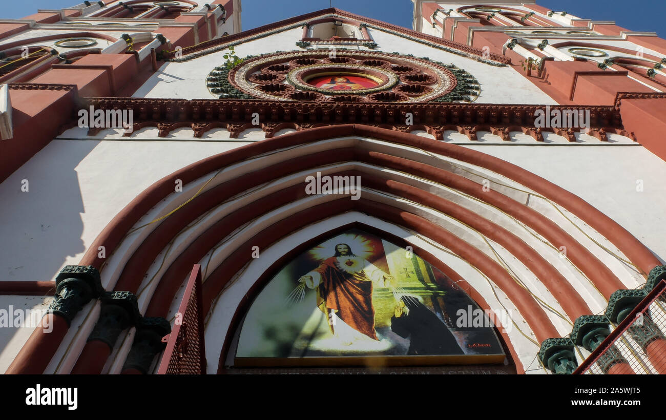 A low angle view upwards towards it's 2 red painted towers and arched ...