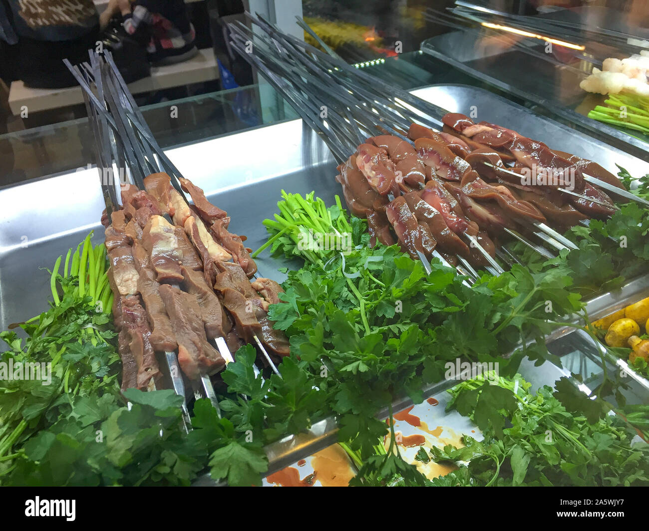 Skewered sheep's meat , heart, liver for grilling in fast-food outlet ...