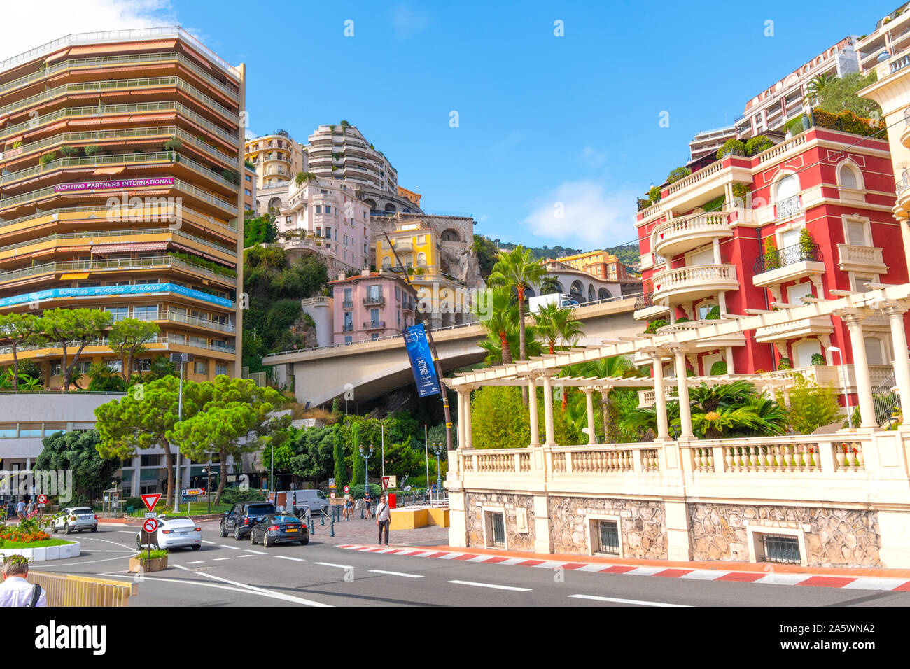 The colorful residential and commercial buildings rise above the ...